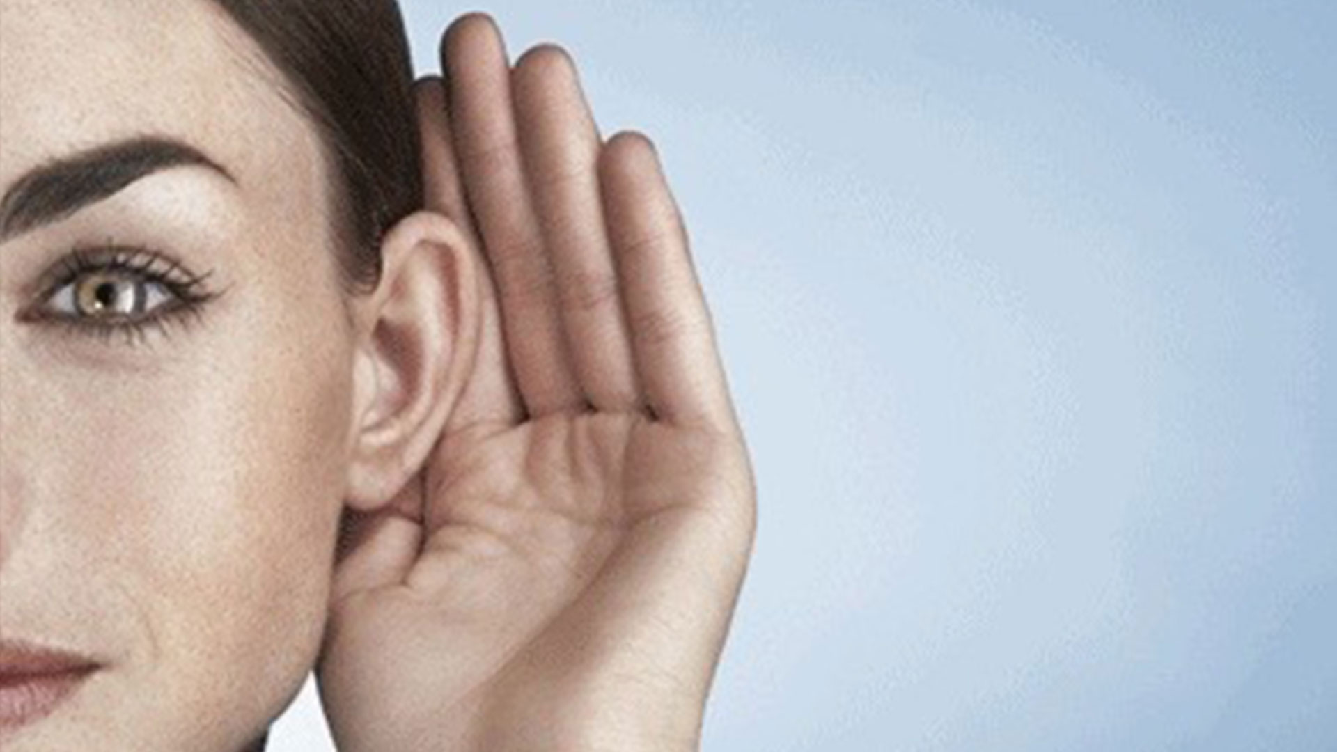 girl-cupping-ear - Musicians' Hearing Services